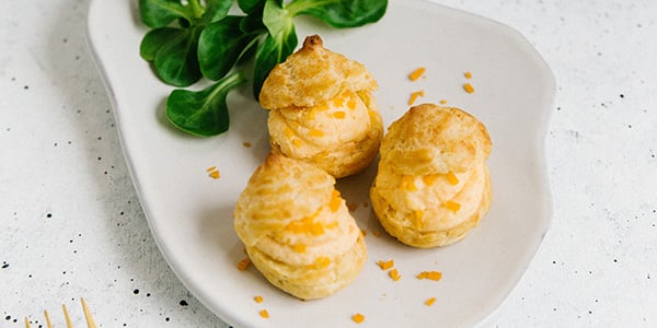 Gougères with Extra-Mature Mimolette Cream Sauce - Isigny Sainte-Mère